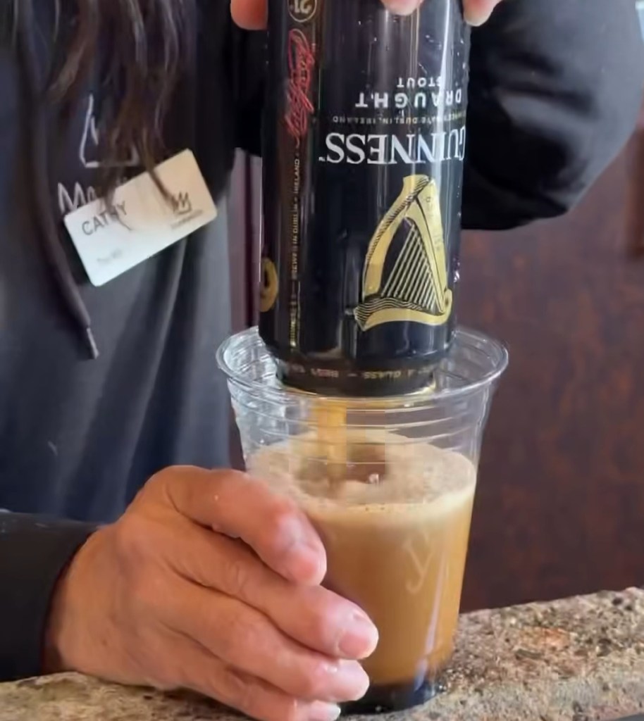 Ella McFadin dunks a can of Guinness in a plastic mug and says it’s the ...